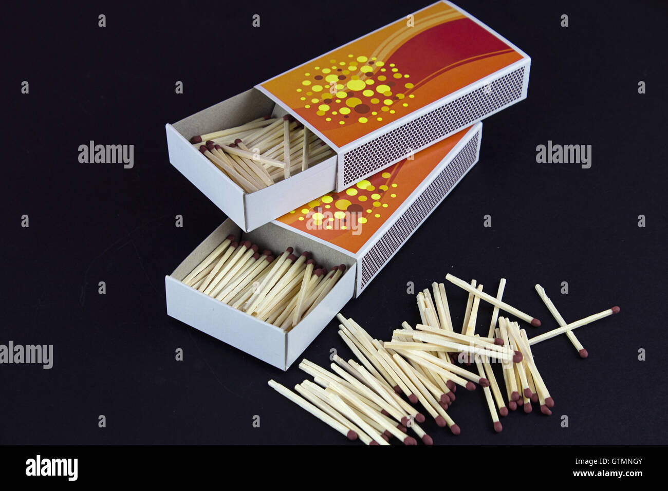 Assorted matches with match box on black background Stock Photo - Alamy