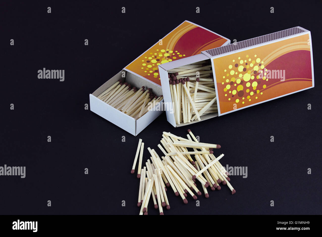 Assorted matches with match box on black background Stock Photo - Alamy
