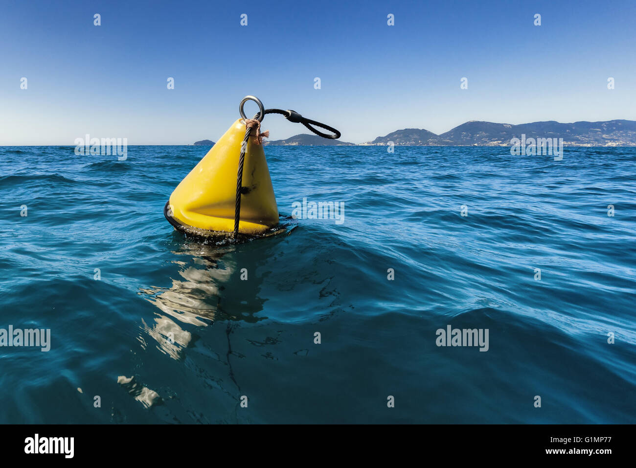 A yellow buoy in the sea Stock Photo - Alamy
