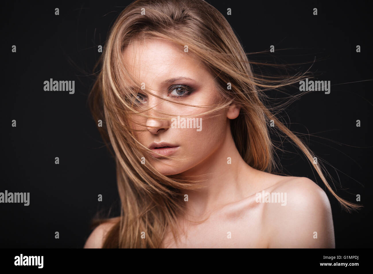 Beauty portrait of attractive woman with fresh skin looking at camera ...