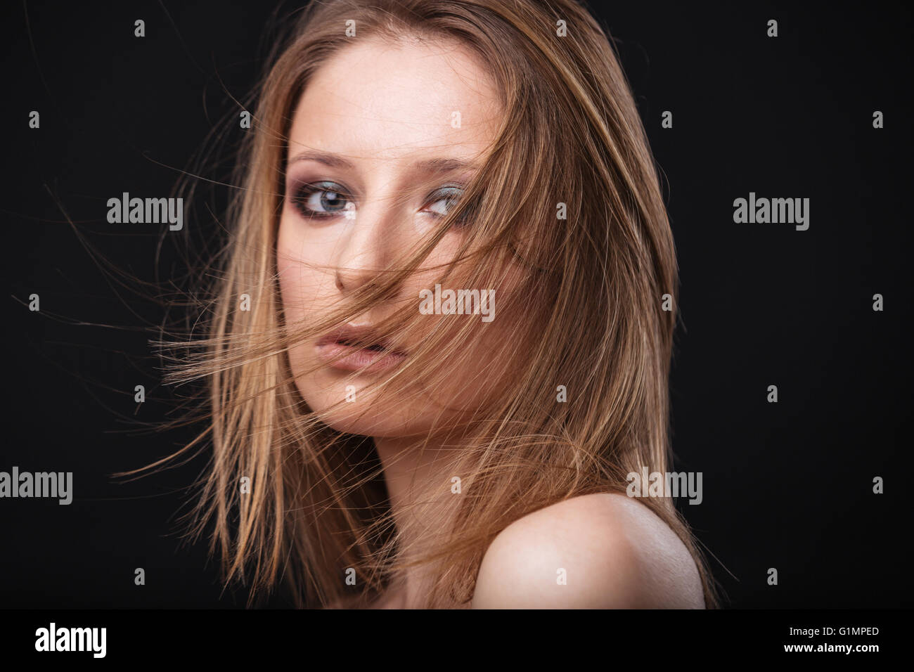 Beauty portrait of attractive woman with fresh skin looking at camera ...