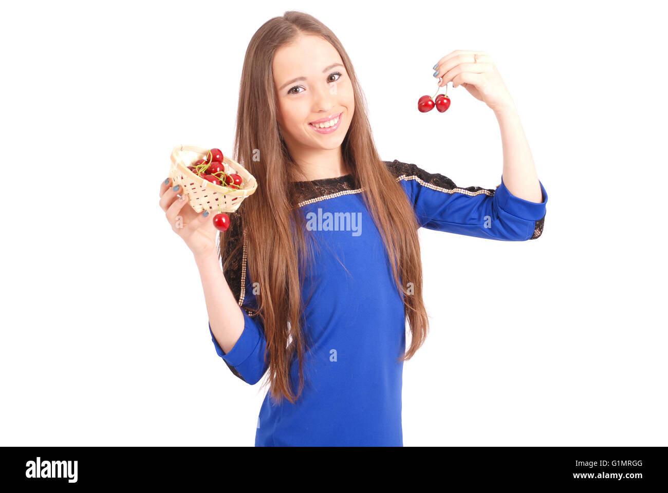 Girl eating cherries isolated on white background Stock Photo - Alamy