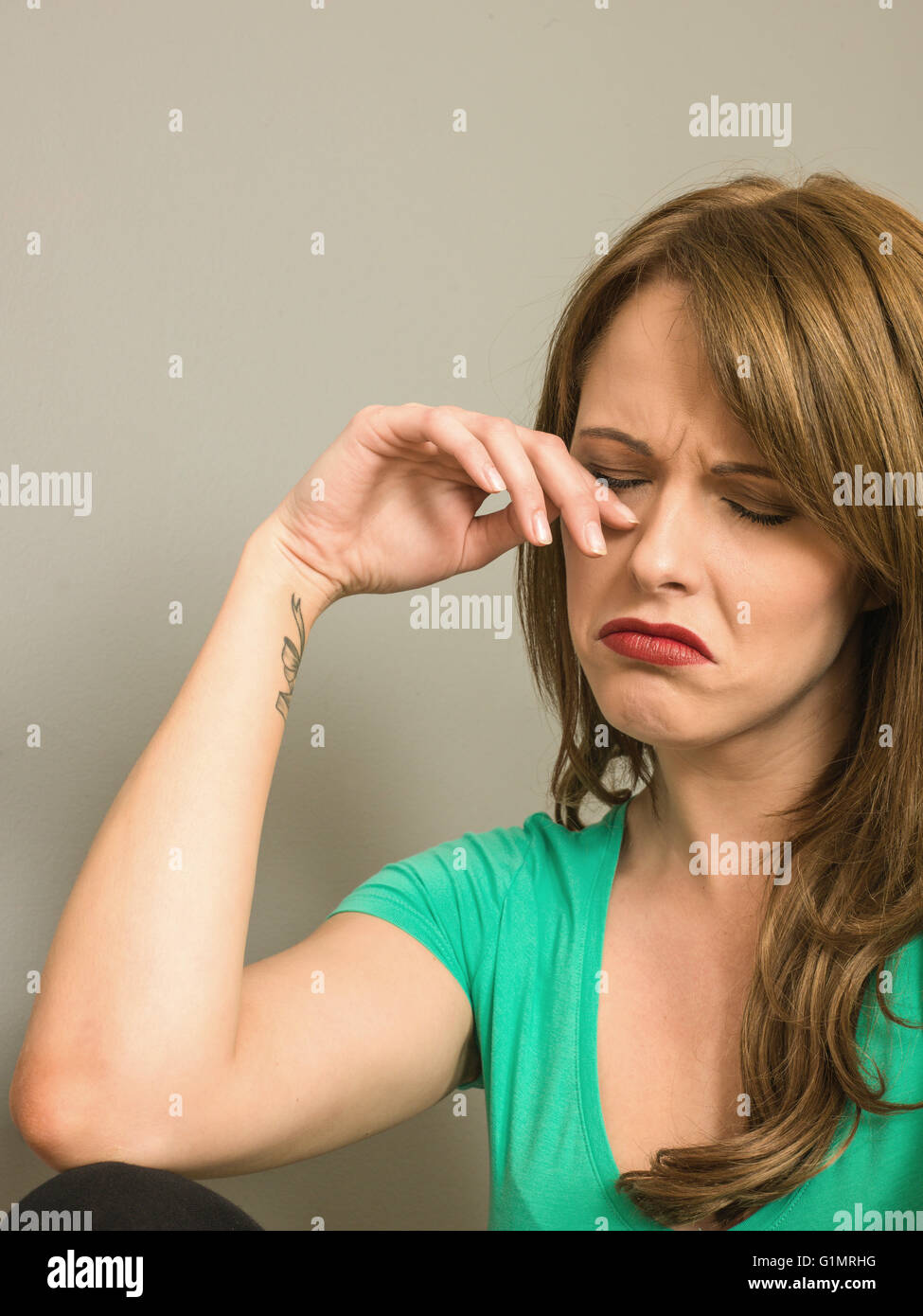 Wiping a tear away hi-res stock photography and images - Alamy
