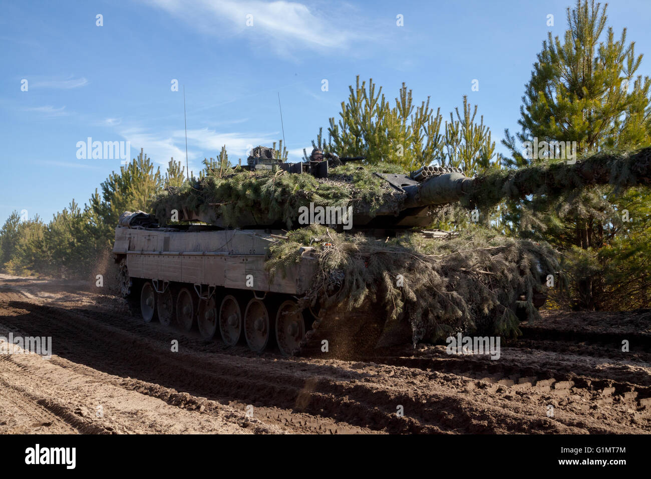 german main battle tank drives on track Stock Photo - Alamy