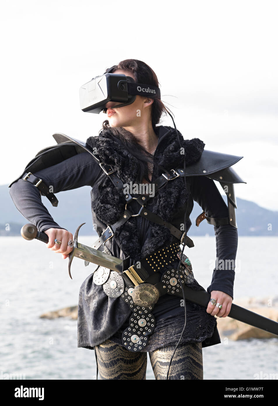Conceptual picture of a young woman wearing costume and Oculus Rift ...