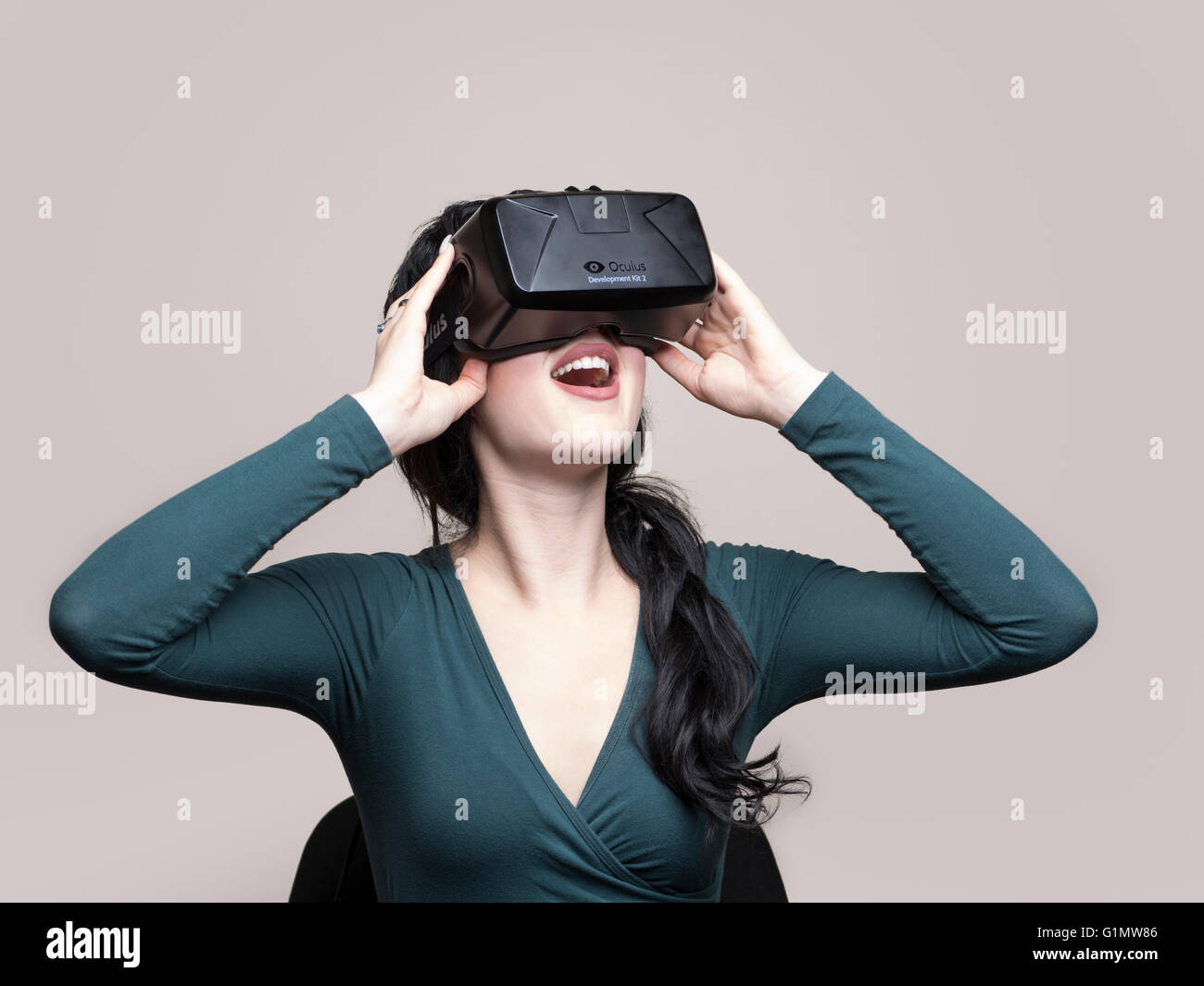 Young Caucasian woman wearing Oculus Rift virtual reality headset ...