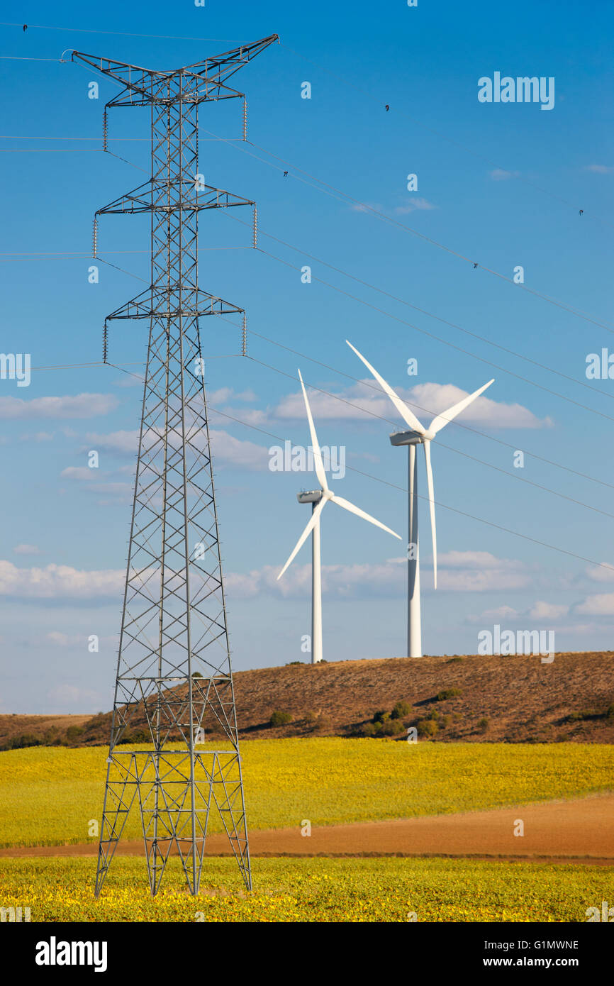 High voltage power lines and wind energy in the countryside. Vertical ...