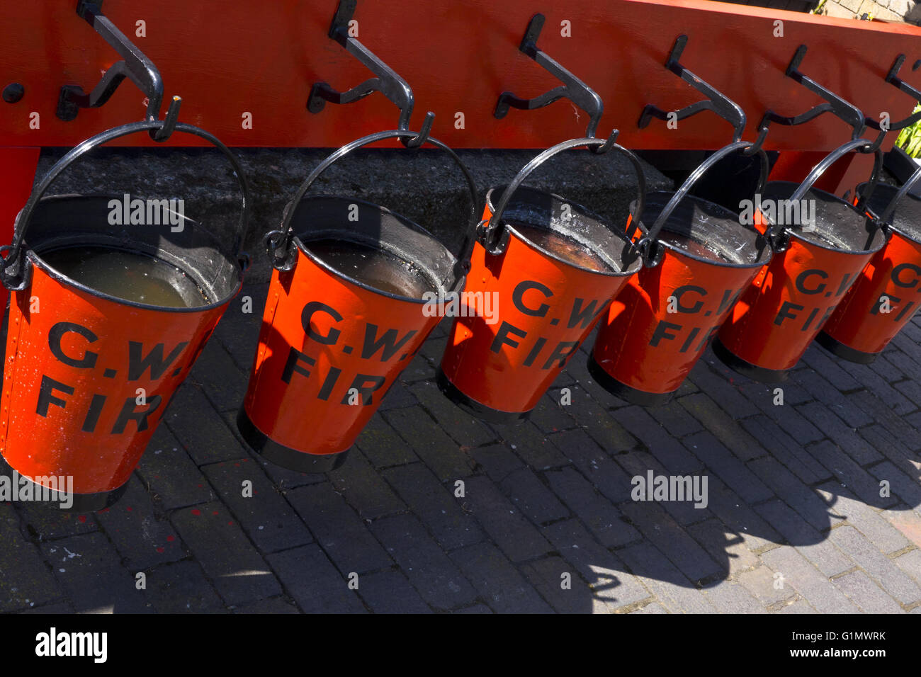 Red fire buckets Stock Photo - Alamy