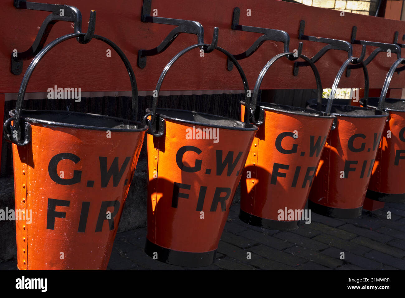 Red fire buckets Stock Photo - Alamy