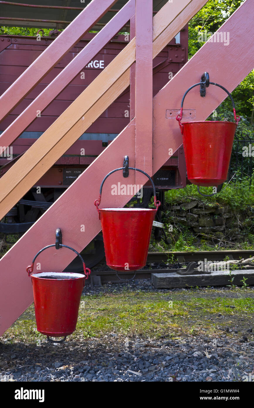Red fire buckets Stock Photo - Alamy