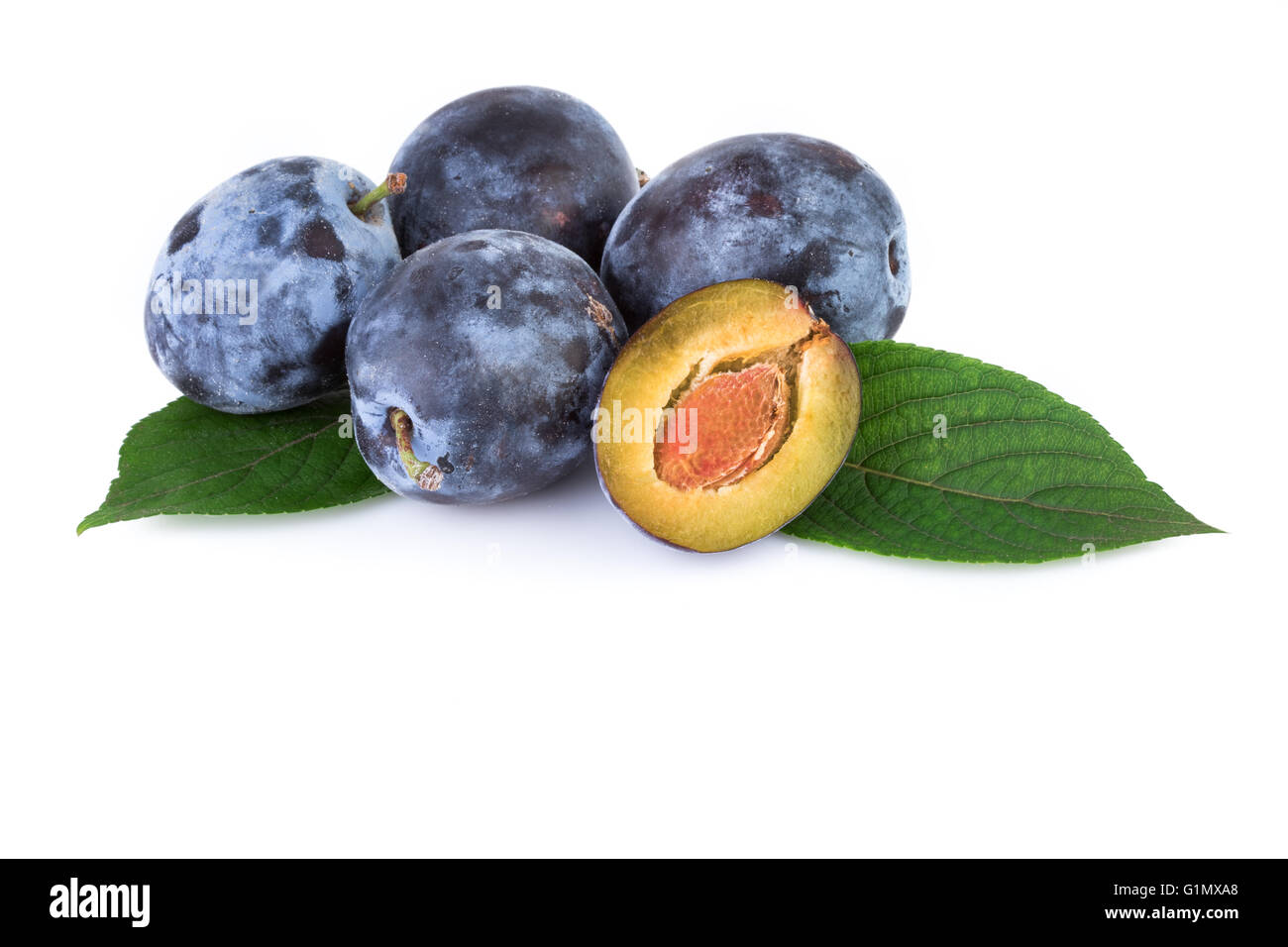 Organic plums with leaves isolated on white background. Closeup Stock ...