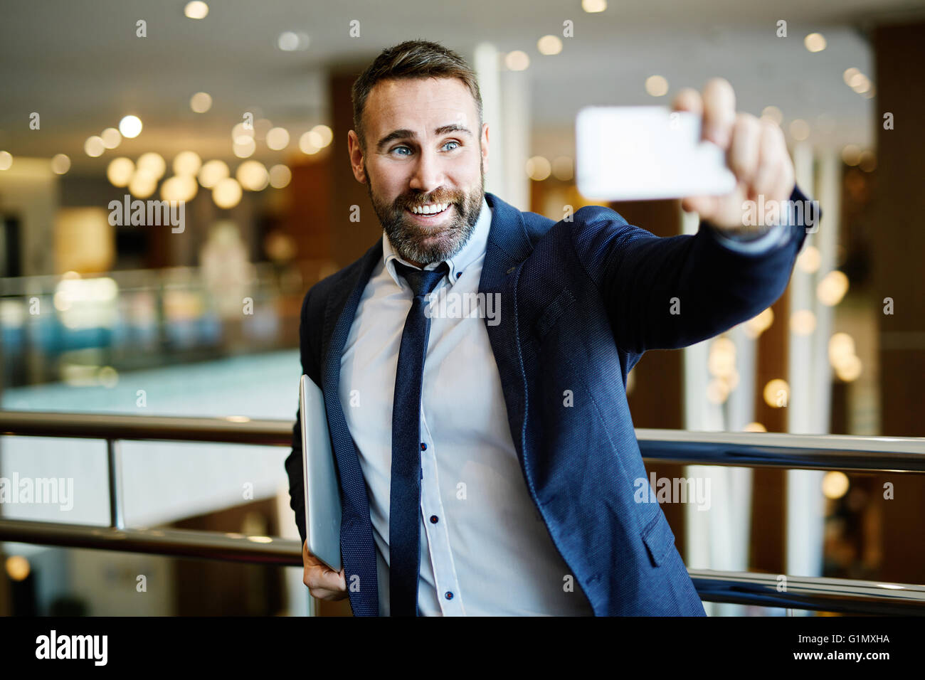 Businessman taking selfie Stock Photo - Alamy