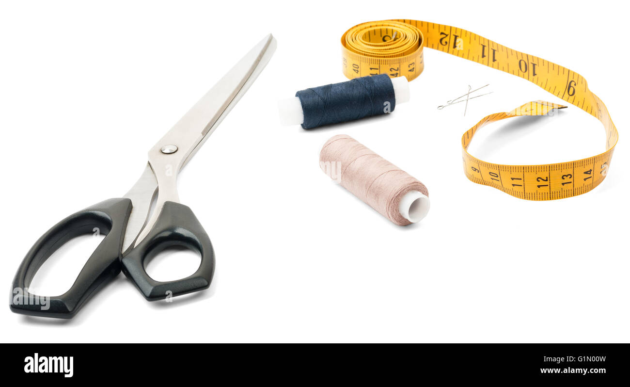 Tailors tools - scissors, thread and tape measure Stock Photo - Alamy