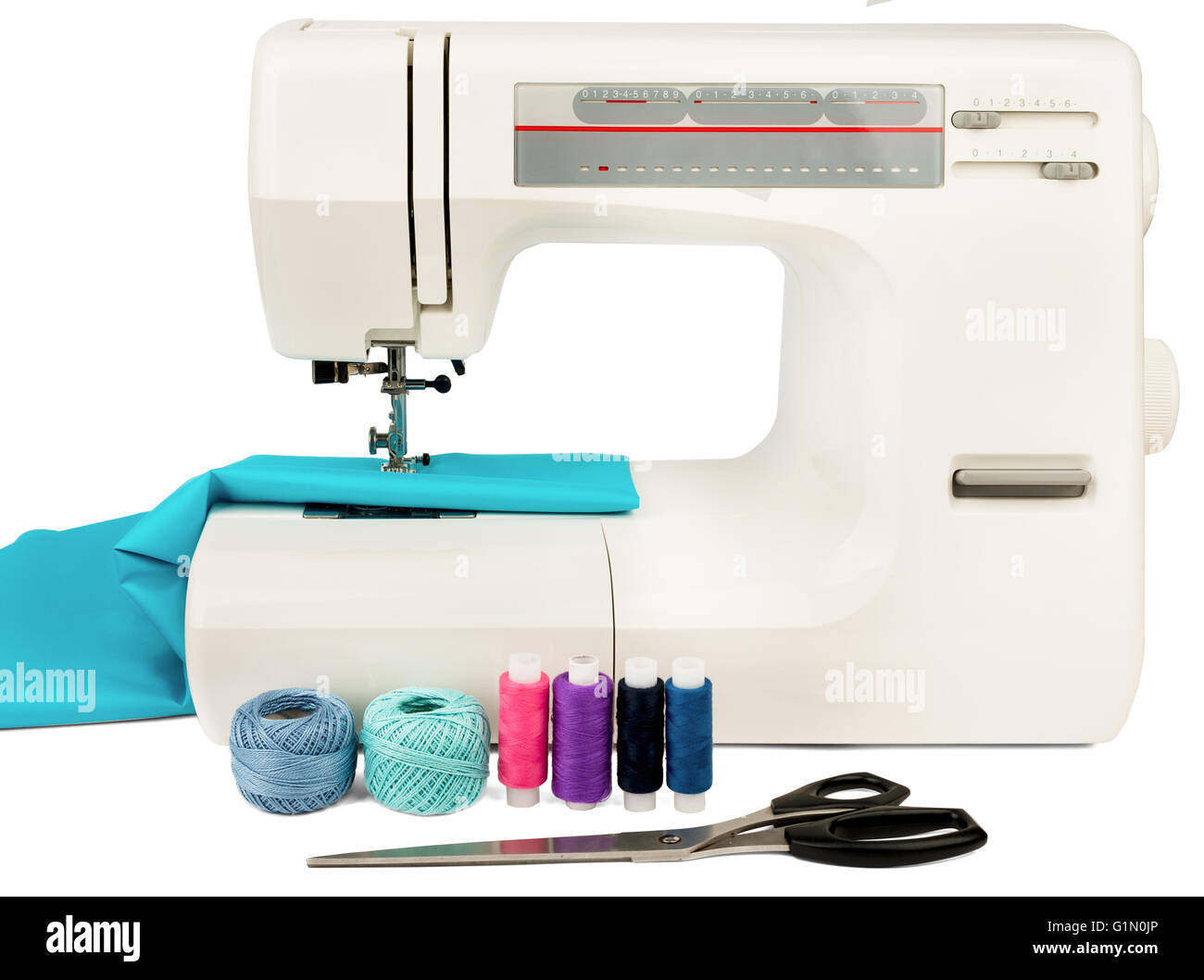 Sewing machine with fabric, threads and scissors Stock Photo - Alamy