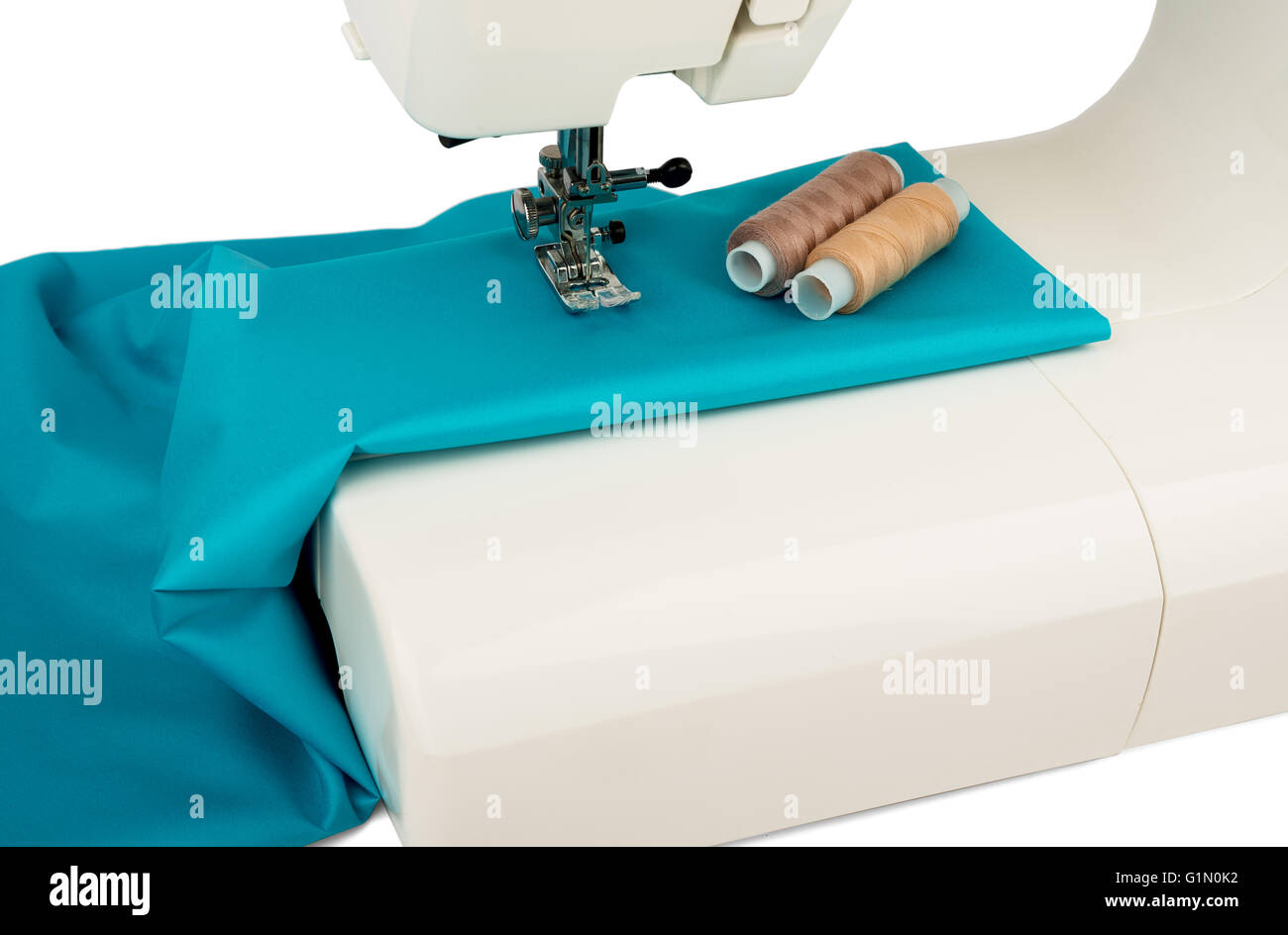 Sewing machine and fabric isolated on white Stock Photo - Alamy