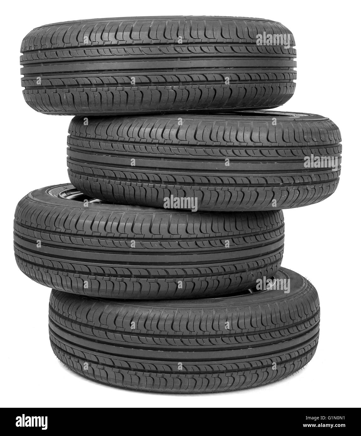 Stack of four wheel black tyres for summer Stock Photo - Alamy