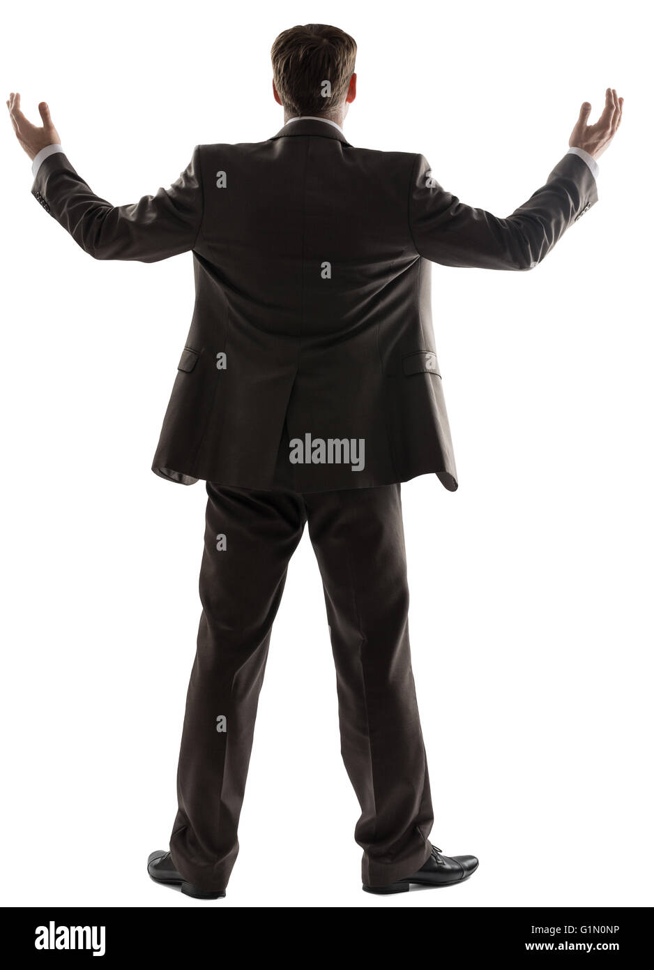 Rear view of successful businessman with arms up Stock Photo - Alamy