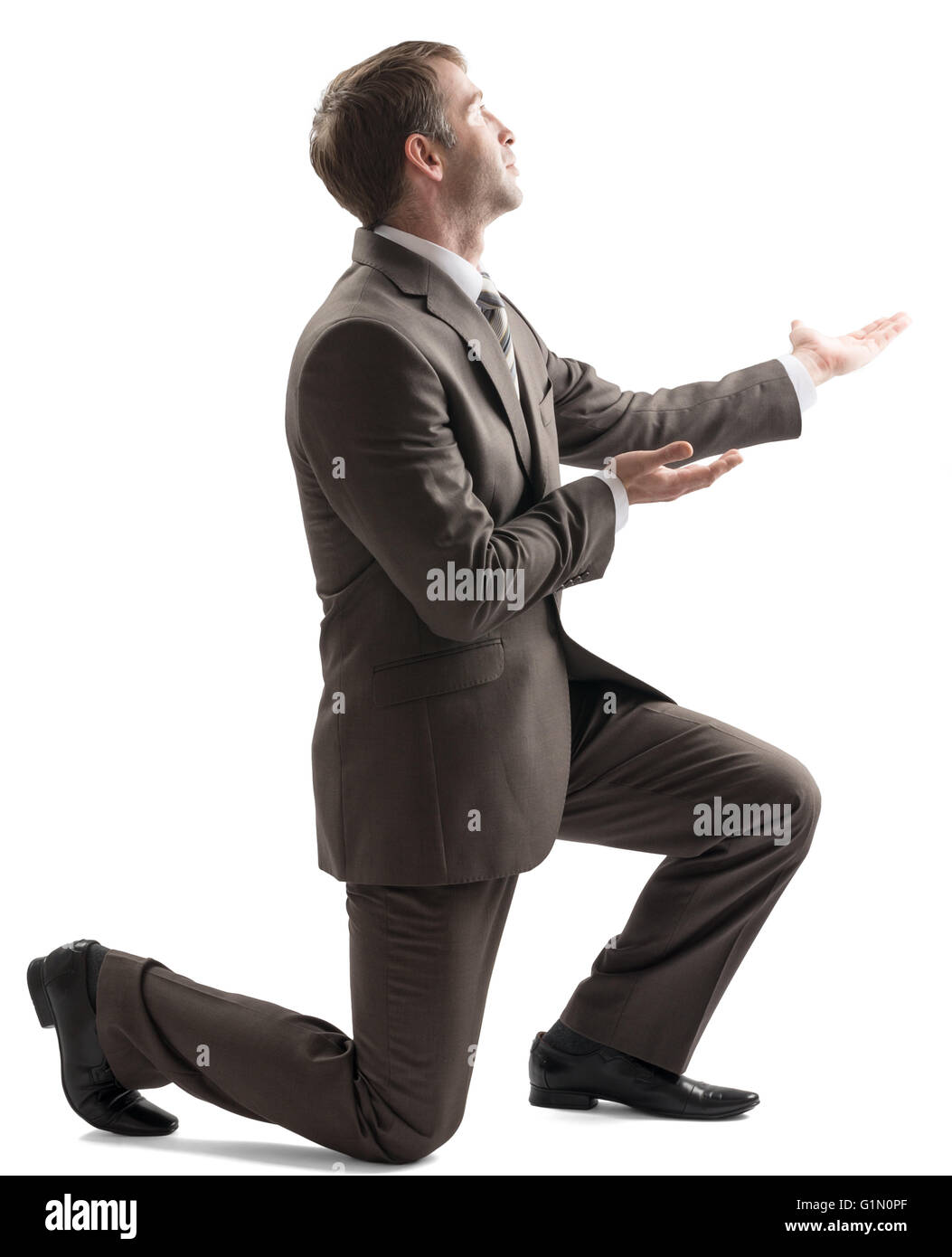 Isolated young man giving something Stock Photo - Alamy