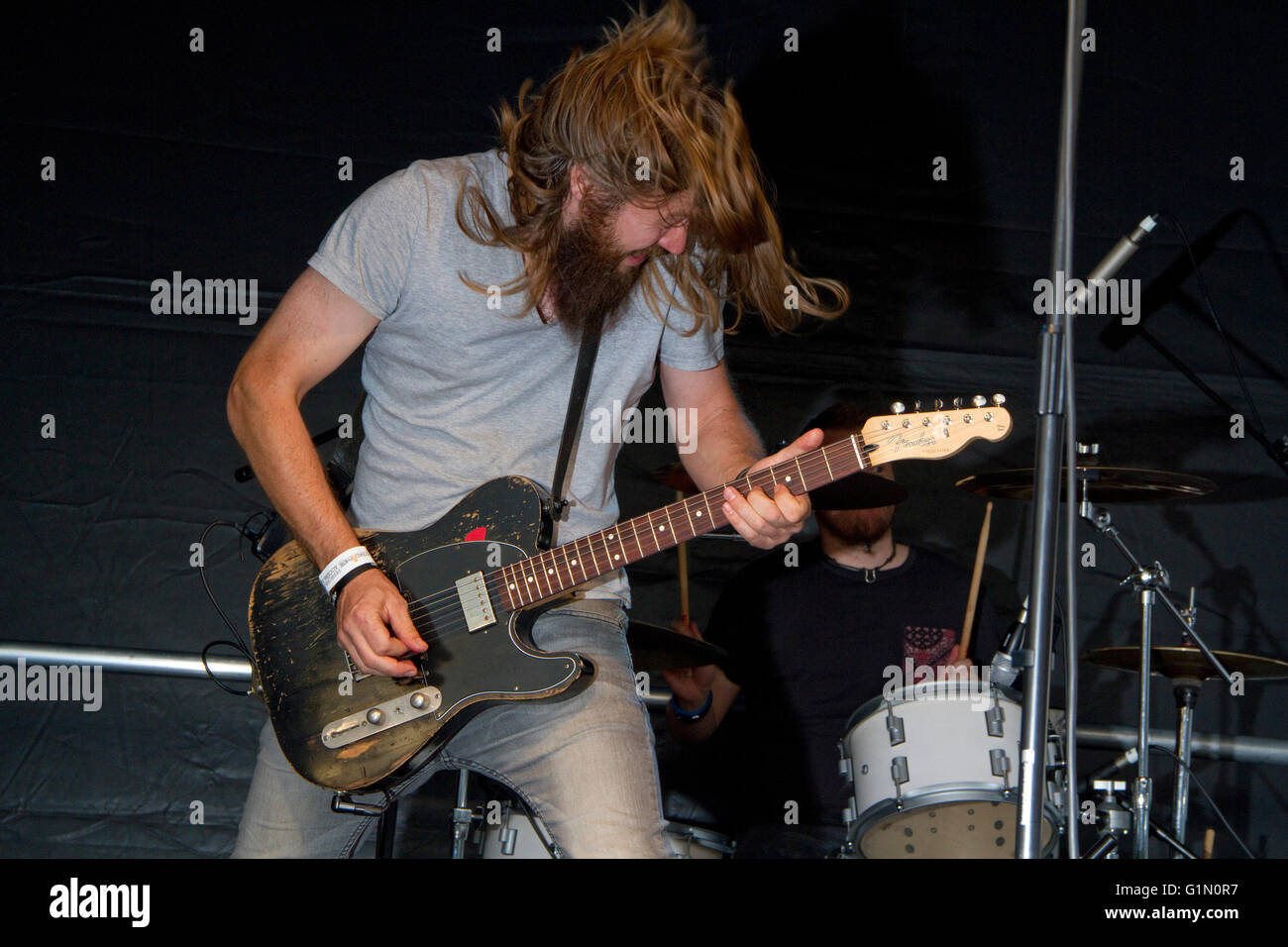 Long haired guitarist of Norfolk rock band Little Red Kings plays an ...