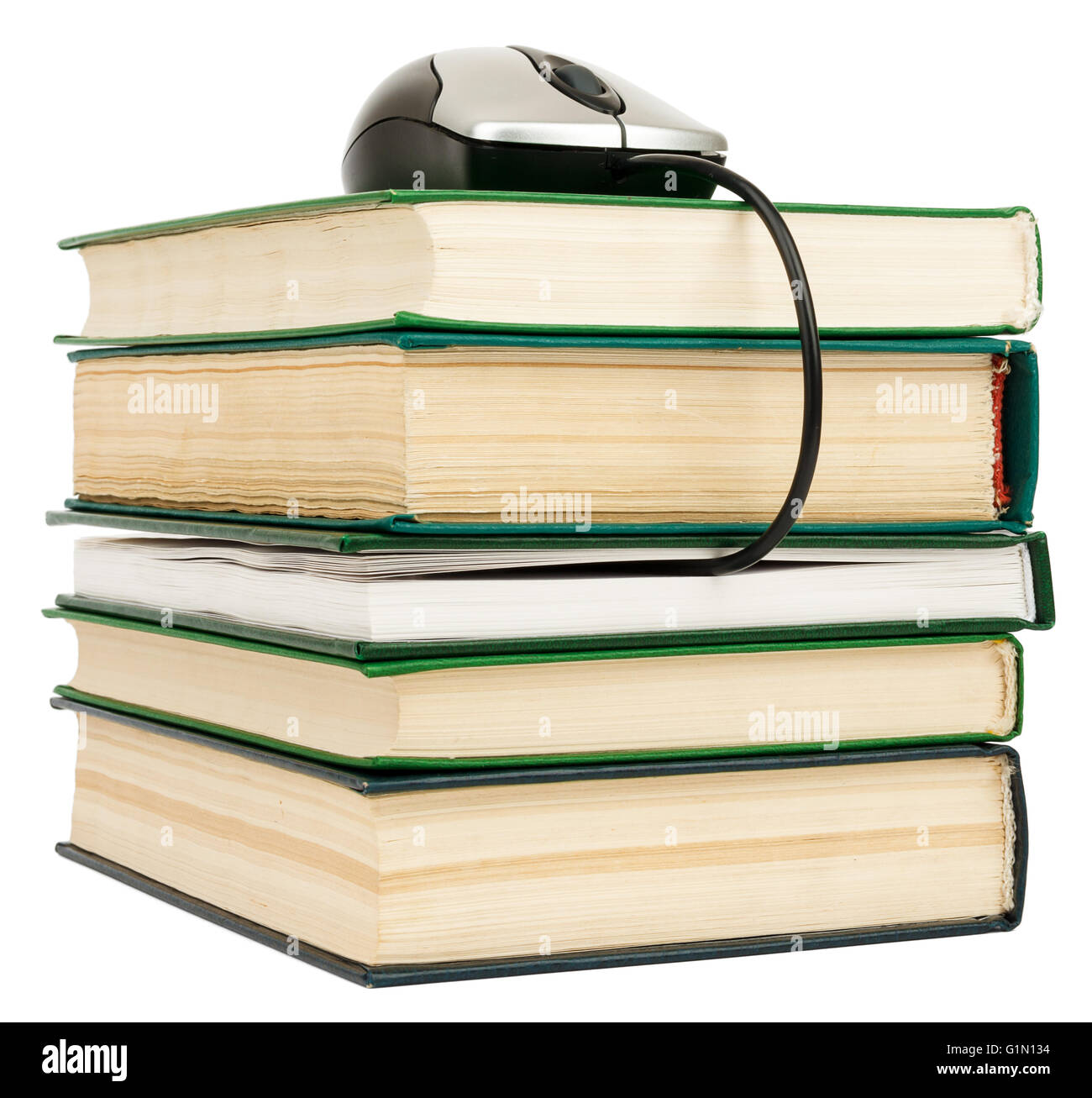 Stack books and computer mouse Stock Photo - Alamy