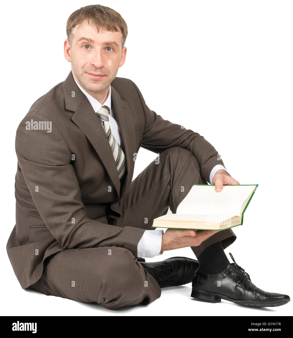 Man sitting with book Stock Photo - Alamy
