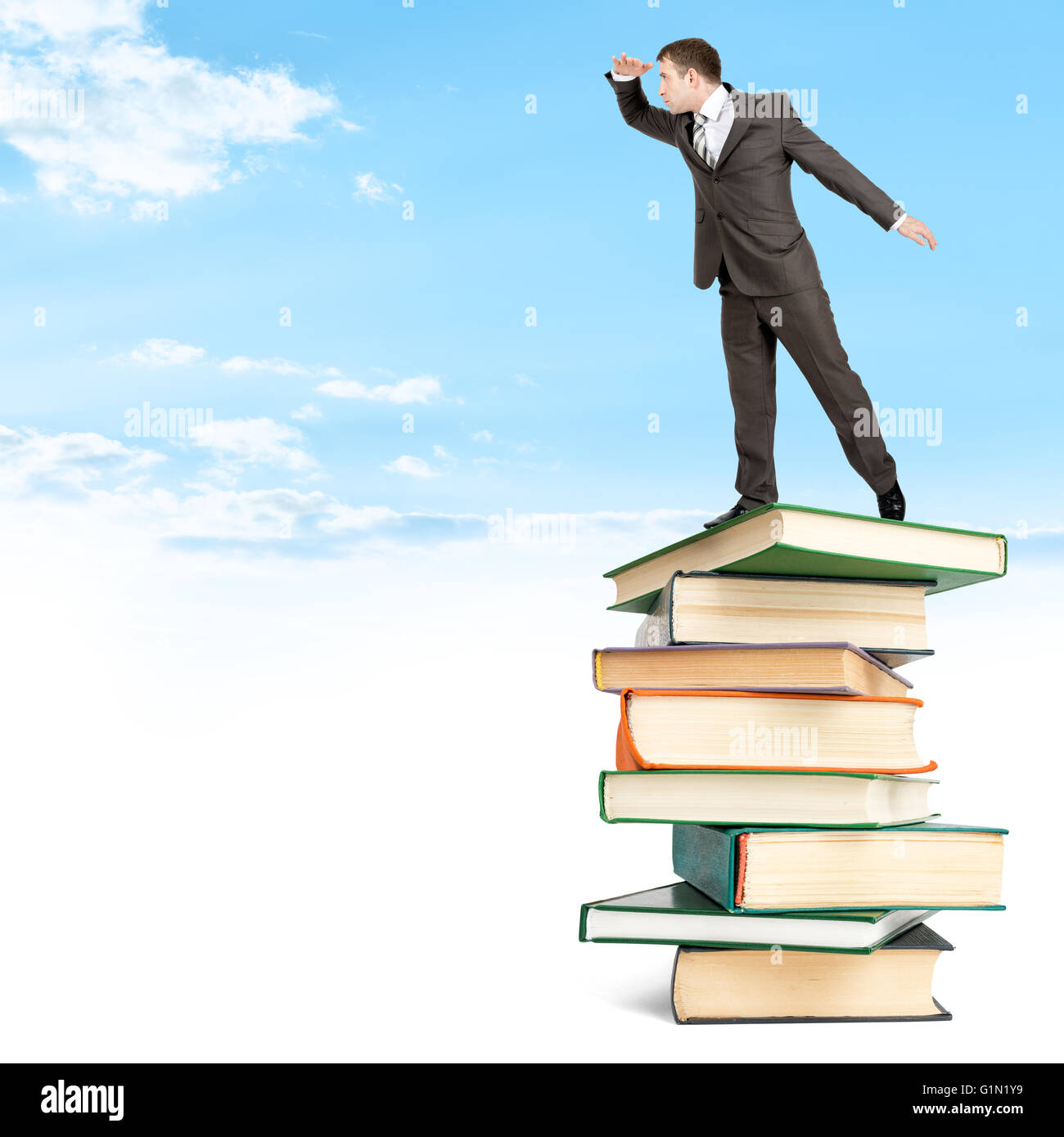 Man standing top on pile books hi-res stock photography and images - Alamy