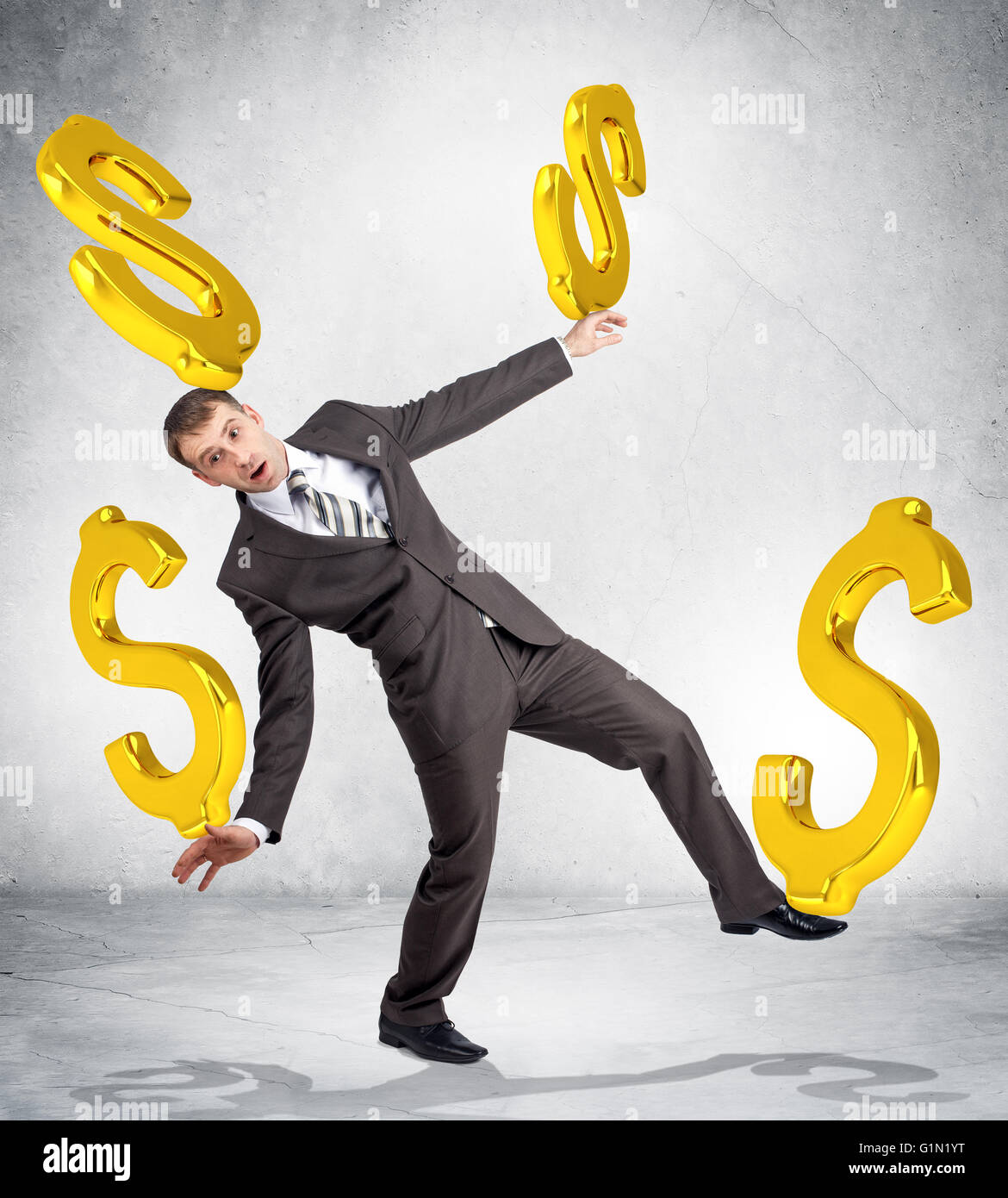 Businessman holding dollar signs Stock Photo - Alamy