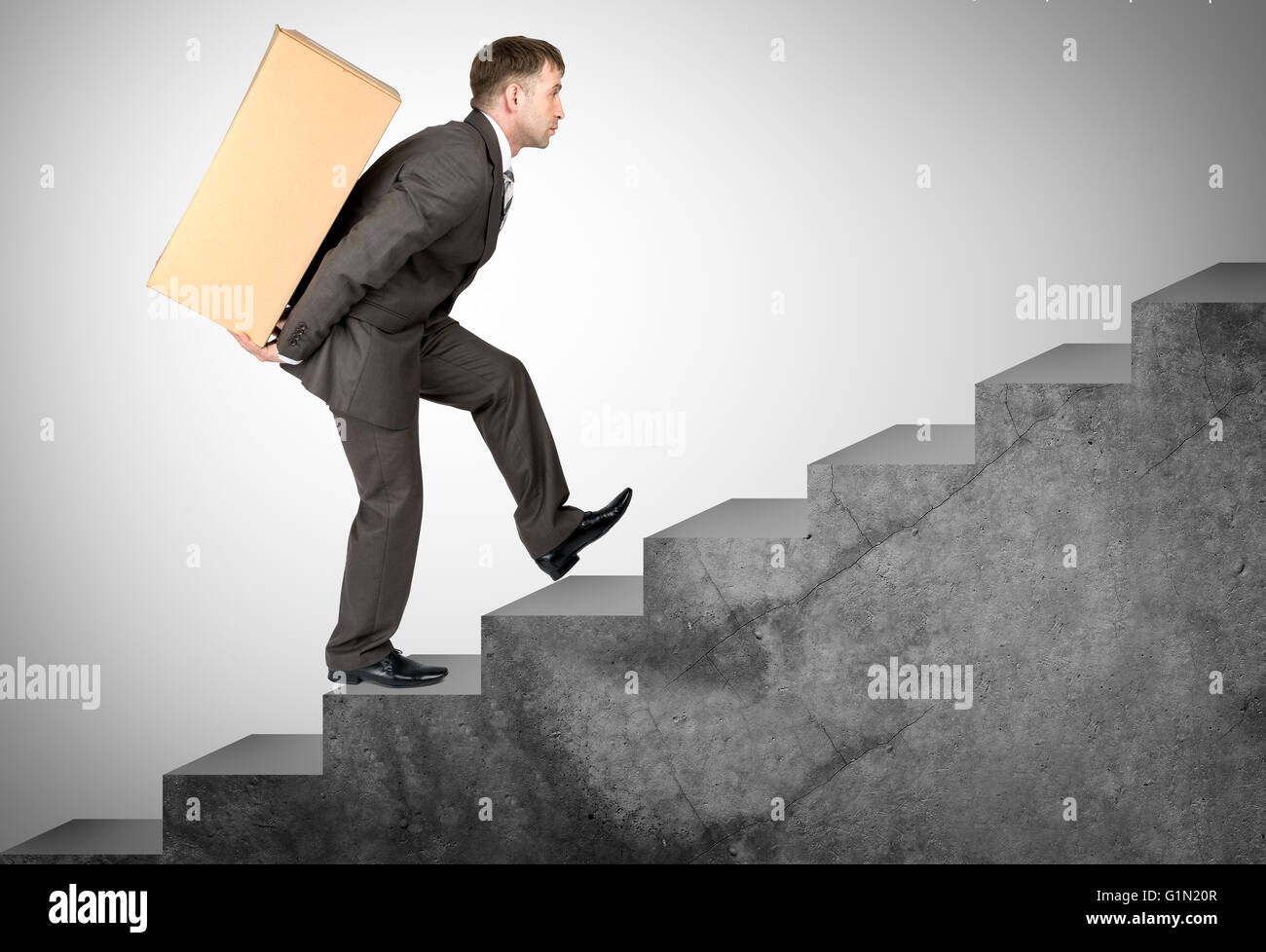 Middle aged business man with difficult task Stock Photo - Alamy