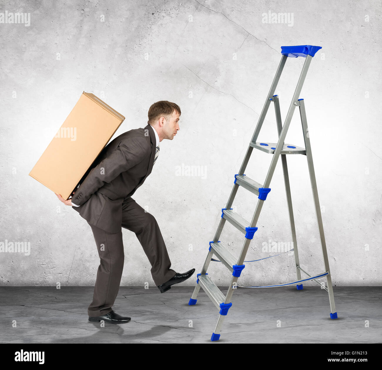 Middle aged business man with difficult task Stock Photo - Alamy