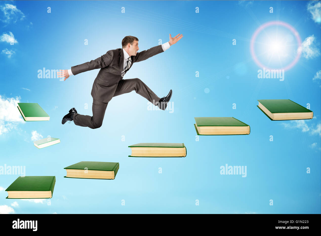Jumping with books hi-res stock photography and images - Alamy