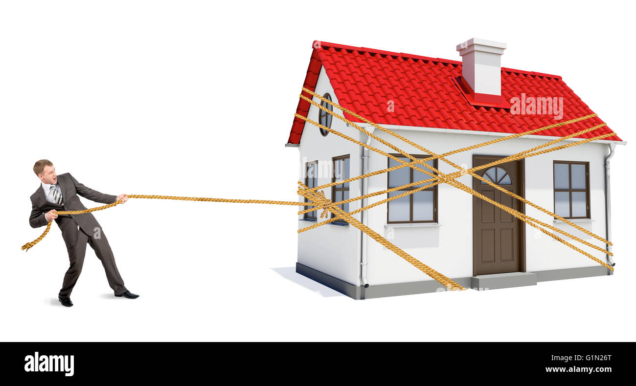 Man pulling rope to move wooden house Stock Photo - Alamy