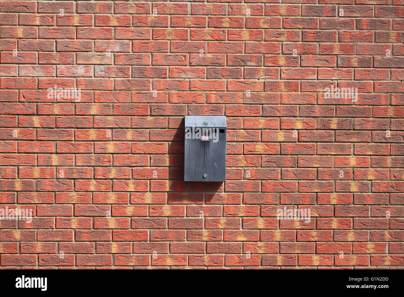 Brick wall and an outside ashtray Stock Photo - Alamy