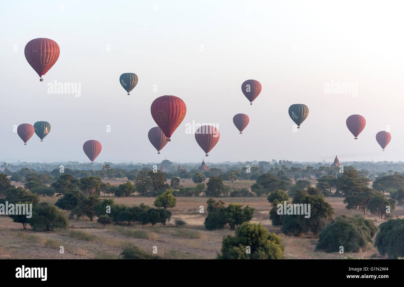 Hot-air Balloons in flight over temples of Bagan as seen from Pyathada ...