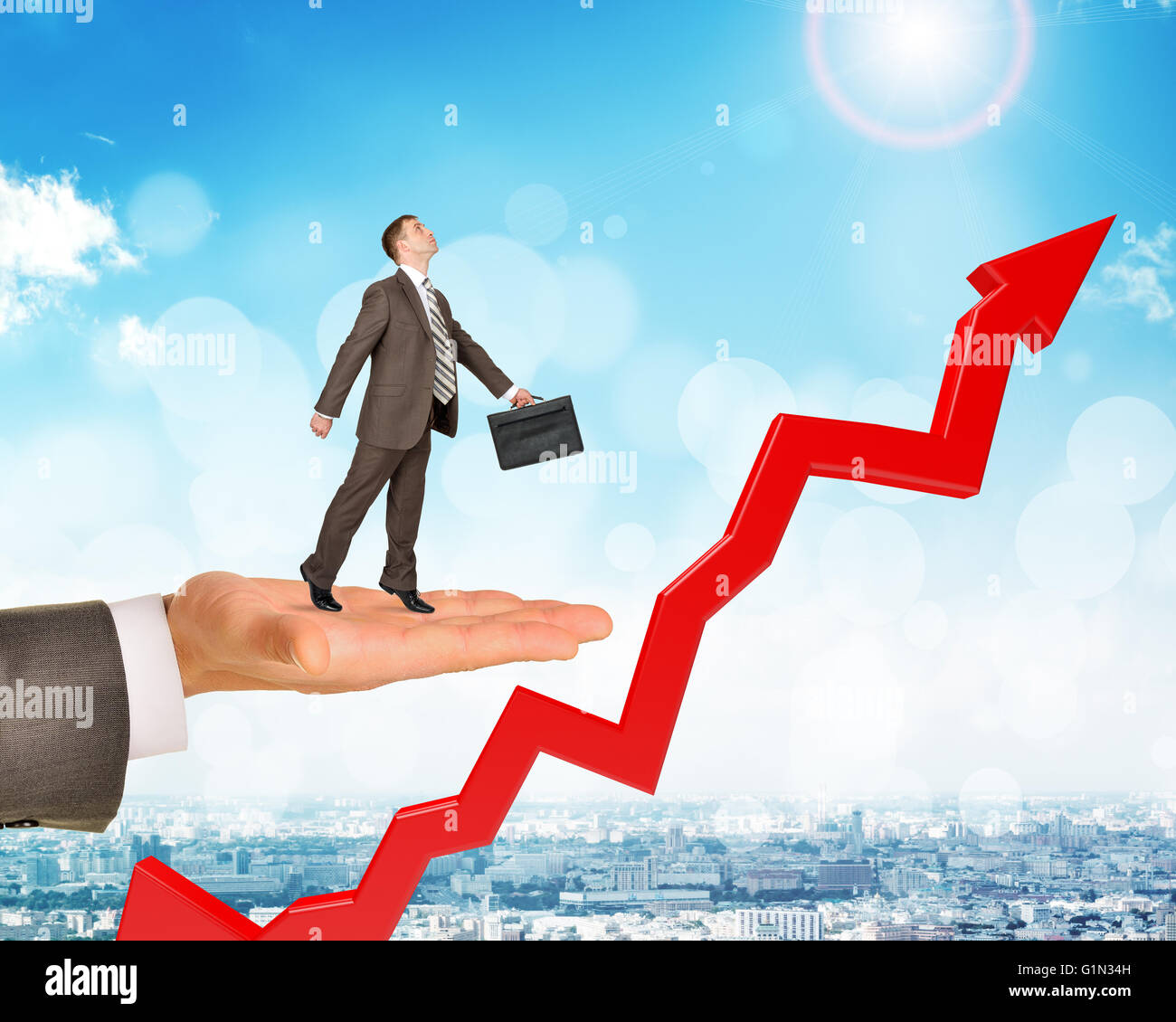 Man holds businessman with growth chart Stock Photo - Alamy
