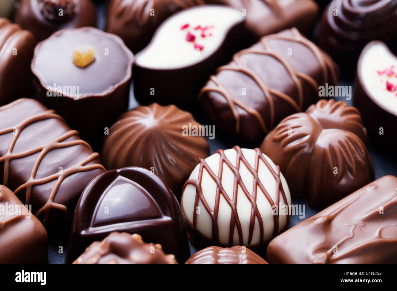 Assortment of fine chocolate candies, white, dark, and milk chocolate ...