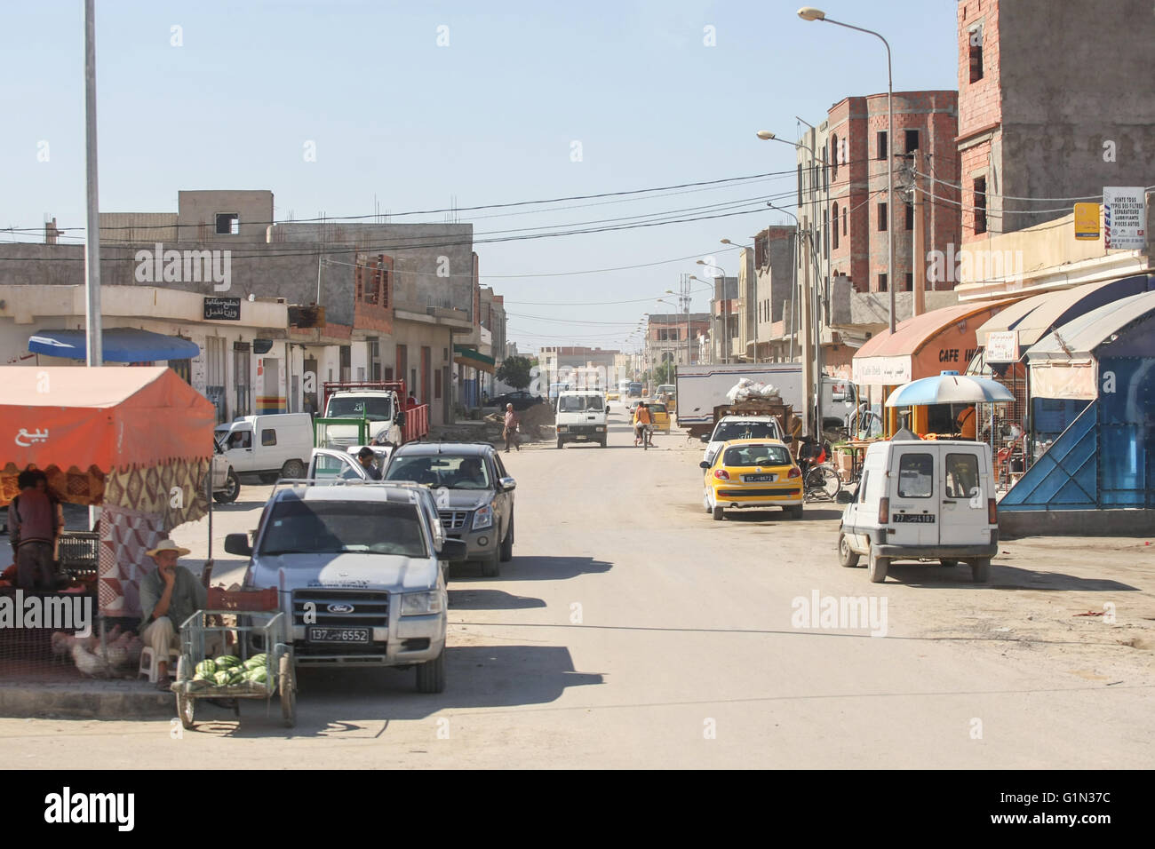 Residential buildings and typical dusty and dirty street full of ...