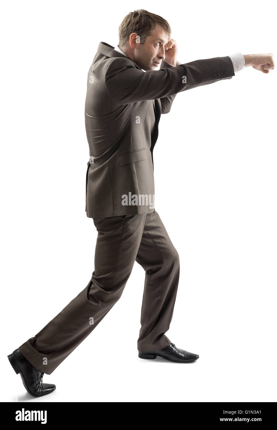 Man in suit punching Stock Photo - Alamy