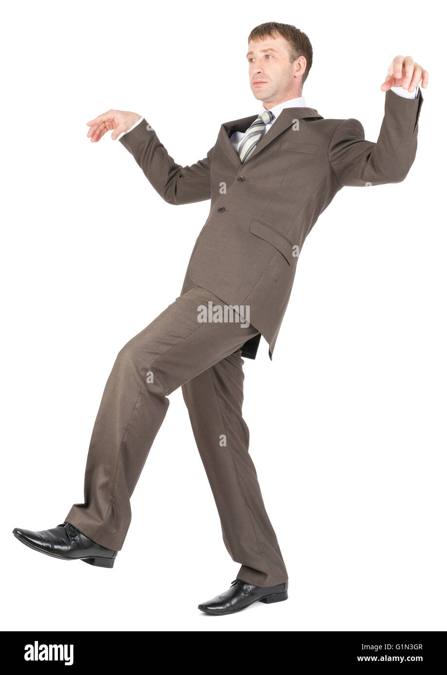 Businessman walking carefully Stock Photo - Alamy