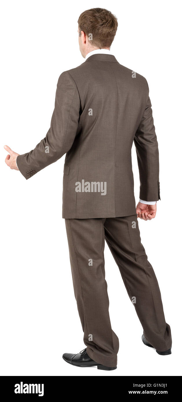 Rear view of man with stretched arm Stock Photo - Alamy