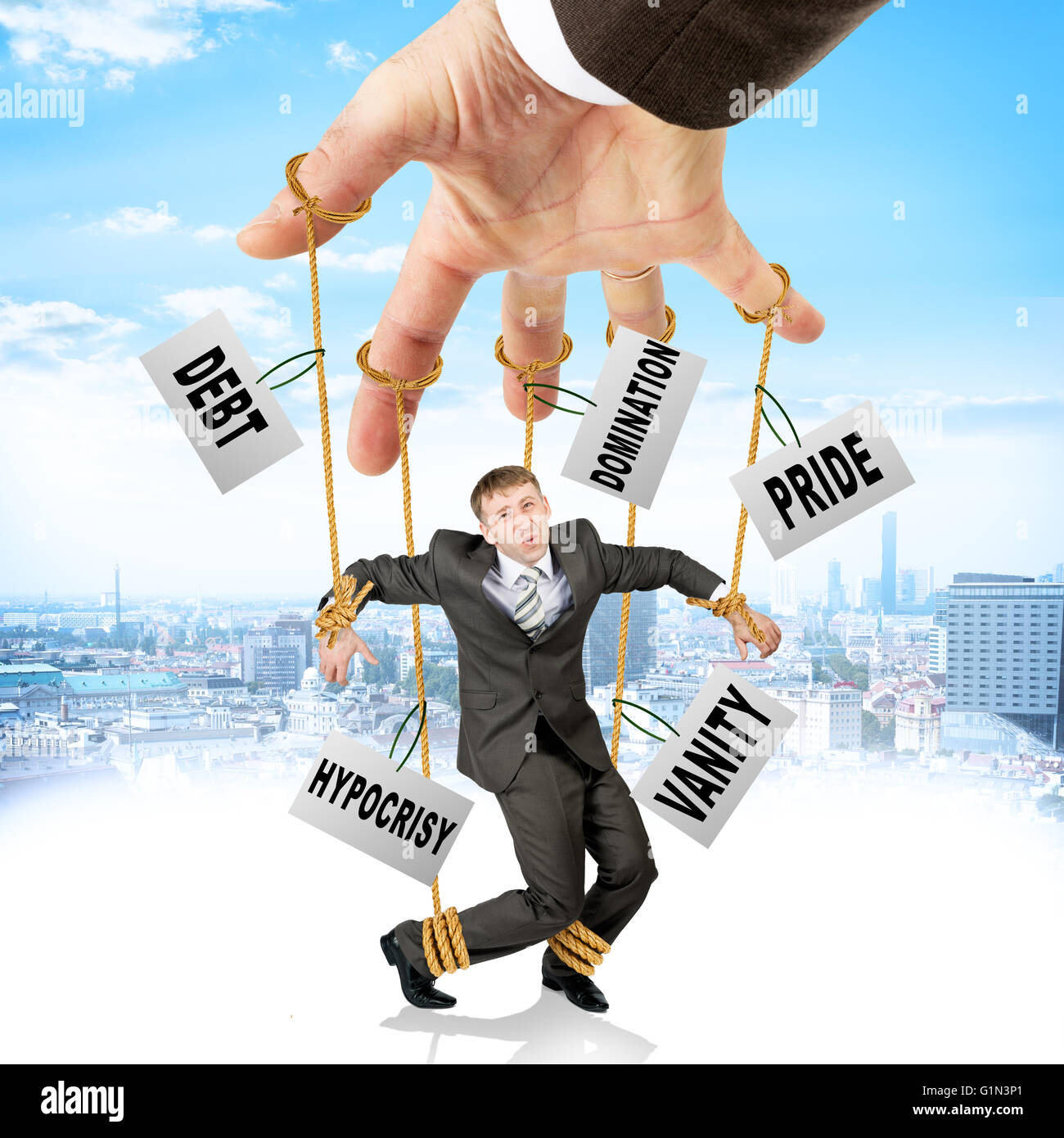 Businessman hanging on strings like marionette Stock Photo - Alamy