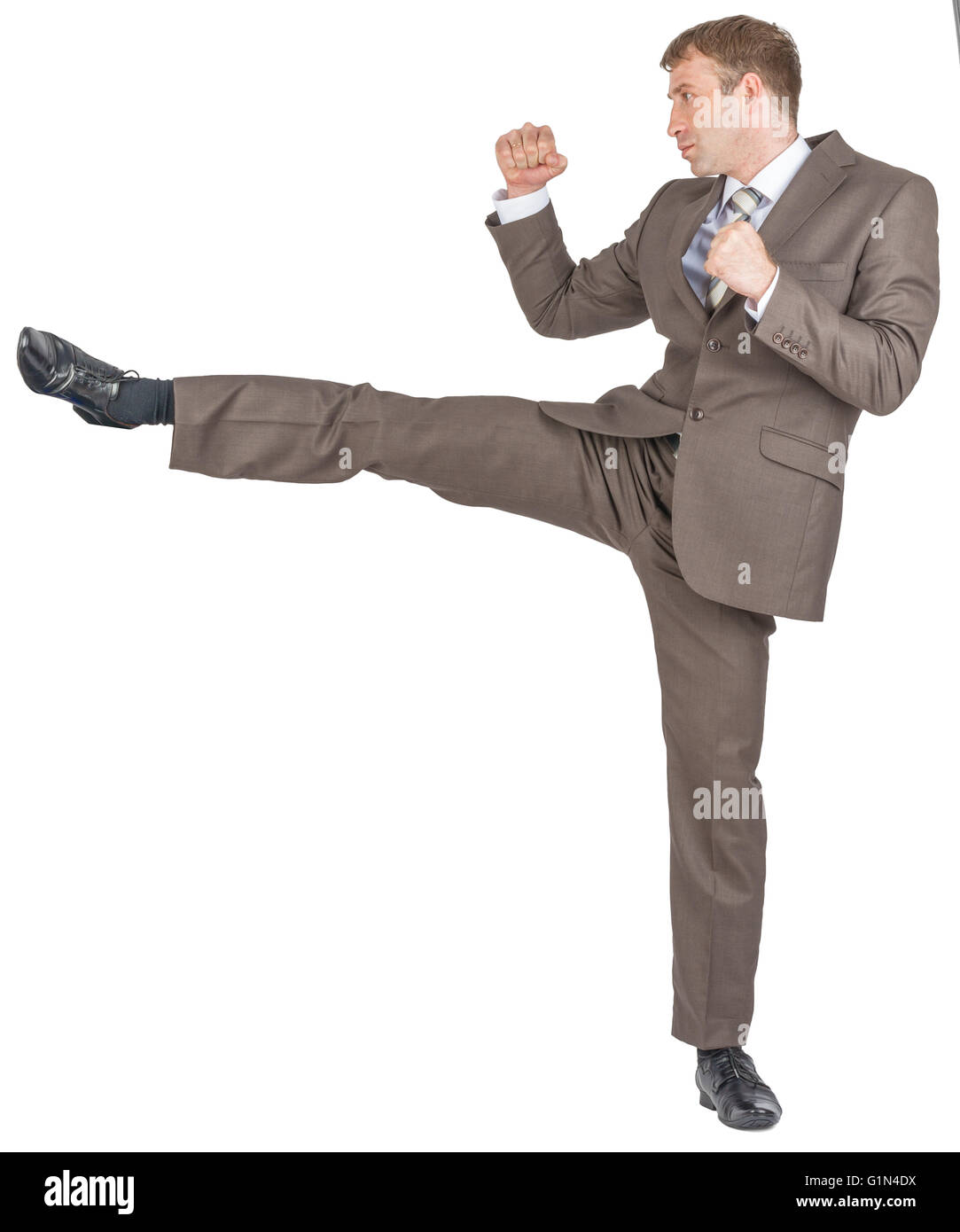 Angry businessman kicking Stock Photo - Alamy