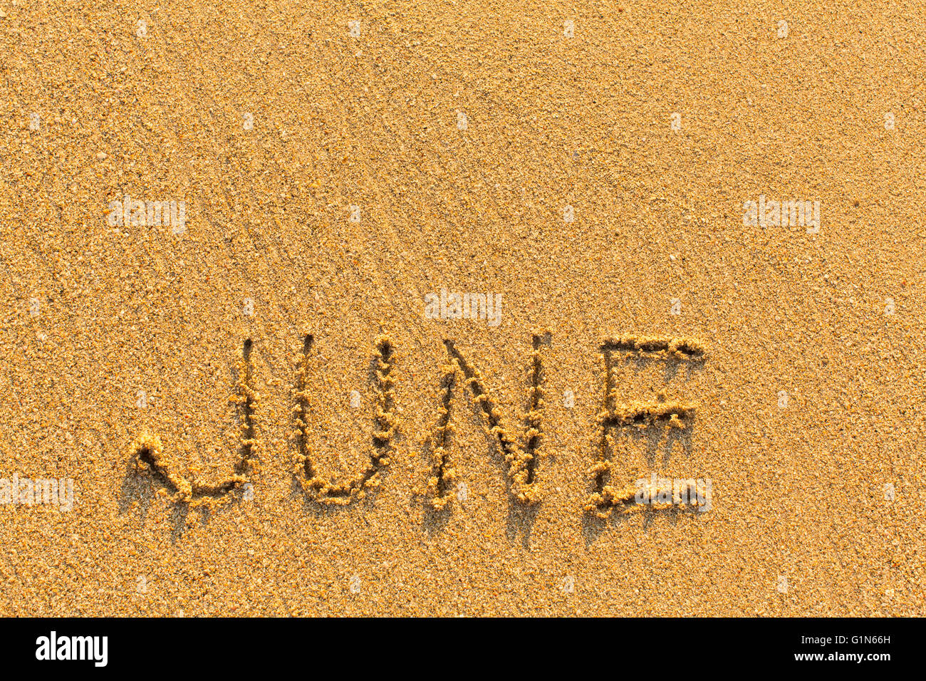 June written on sand summer hi-res stock photography and images - Alamy