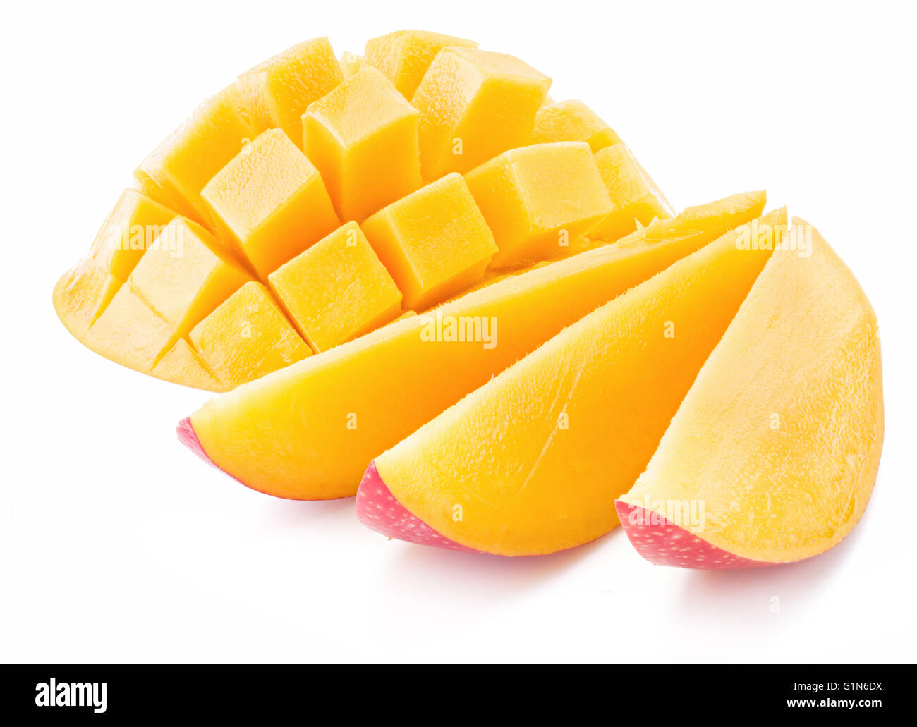 Mango cubes and slices. Isolated on a white background Stock Photo - Alamy