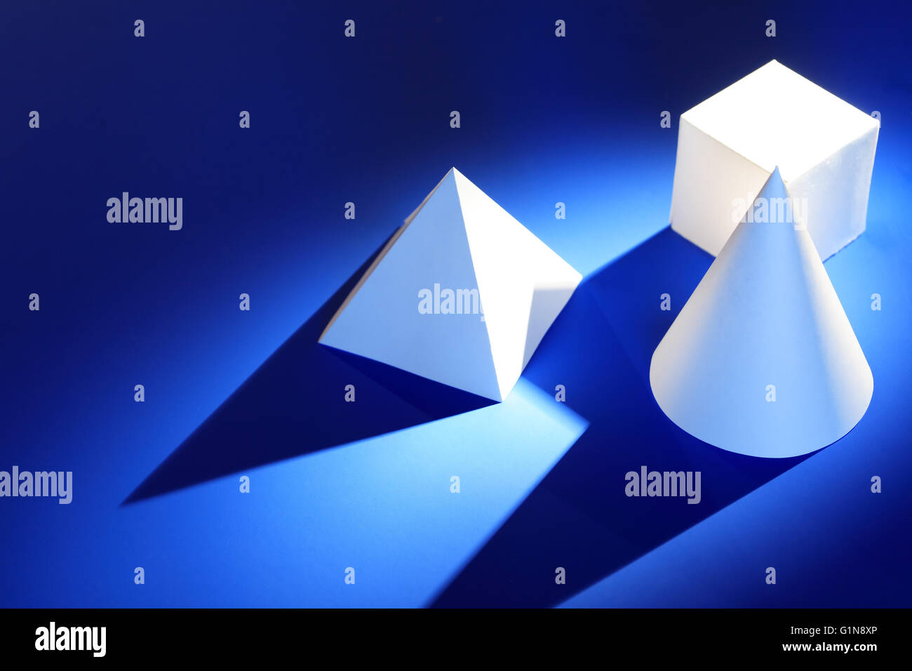 Geometry concept. Set of various paper shapes on blue background Stock ...