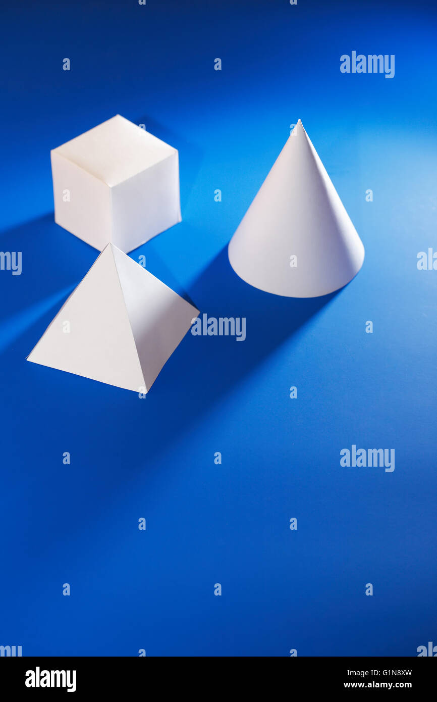 Geometry concept. Set of various paper shapes on blue background Stock ...