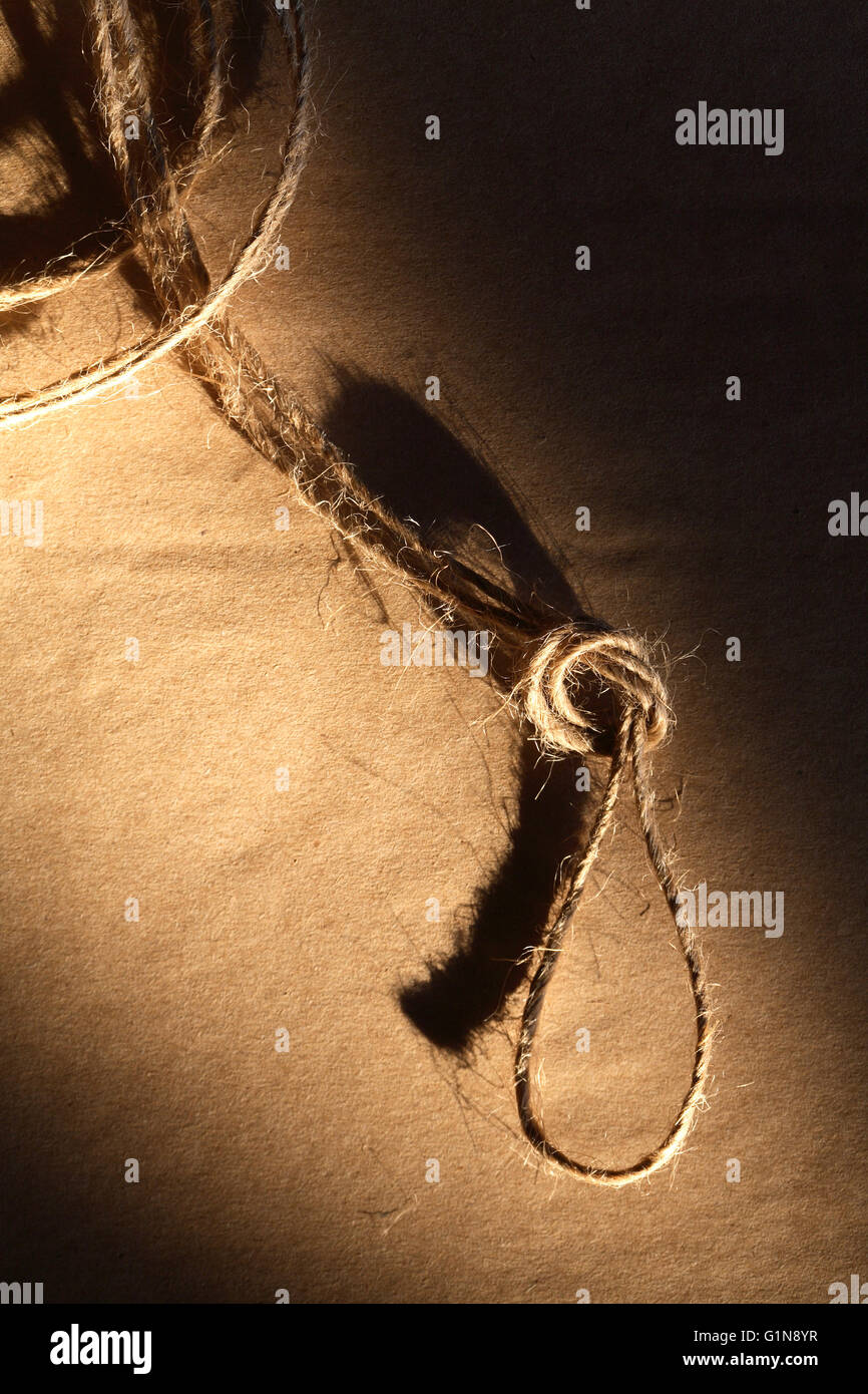 Twine with loop on old brown paper with shadow Stock Photo - Alamy