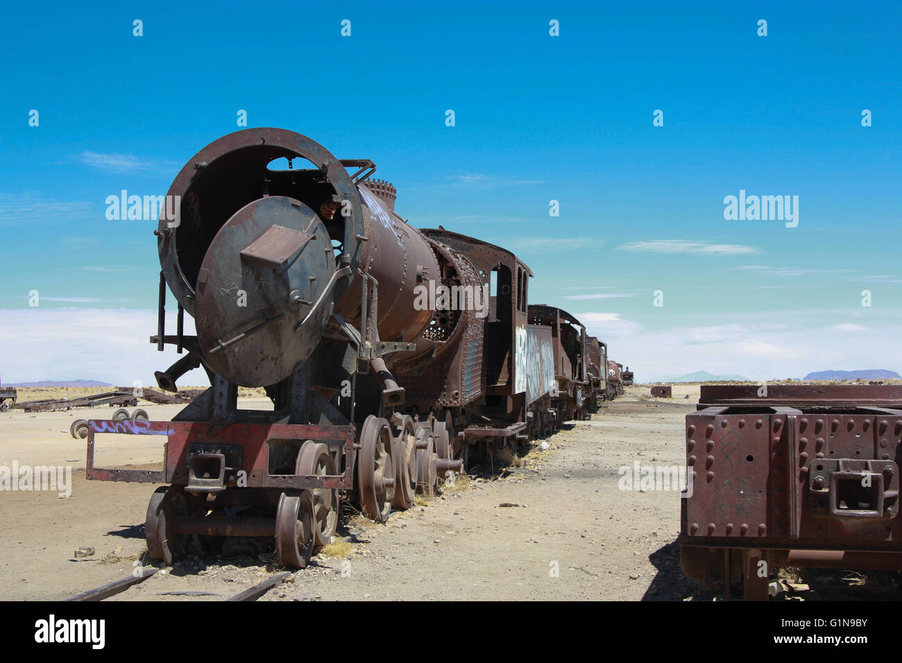 Abandoned rusty train on train cemetery in Uyuni Bolivia Stock Photo ...