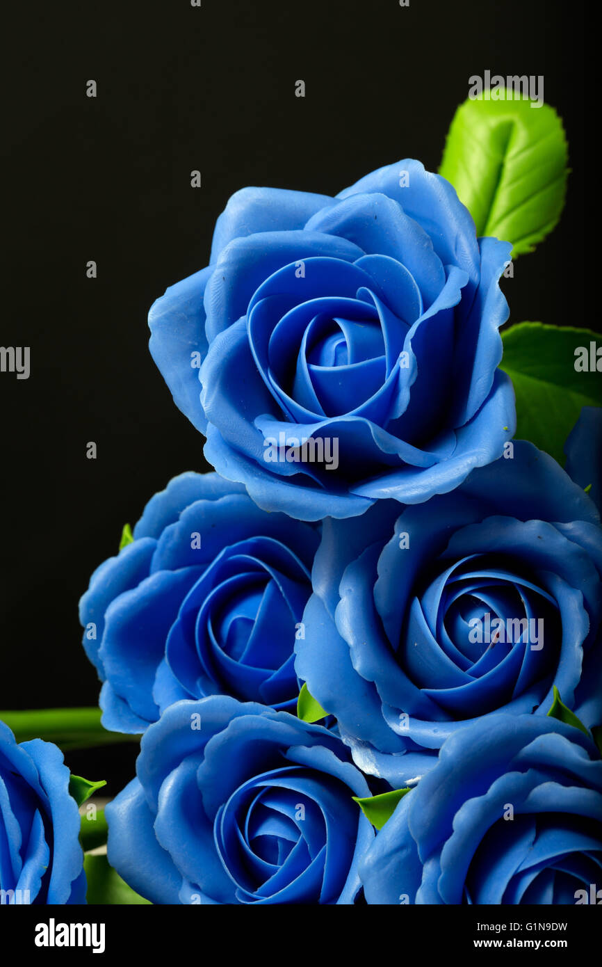 Blue rose made from clay Stock Photo - Alamy