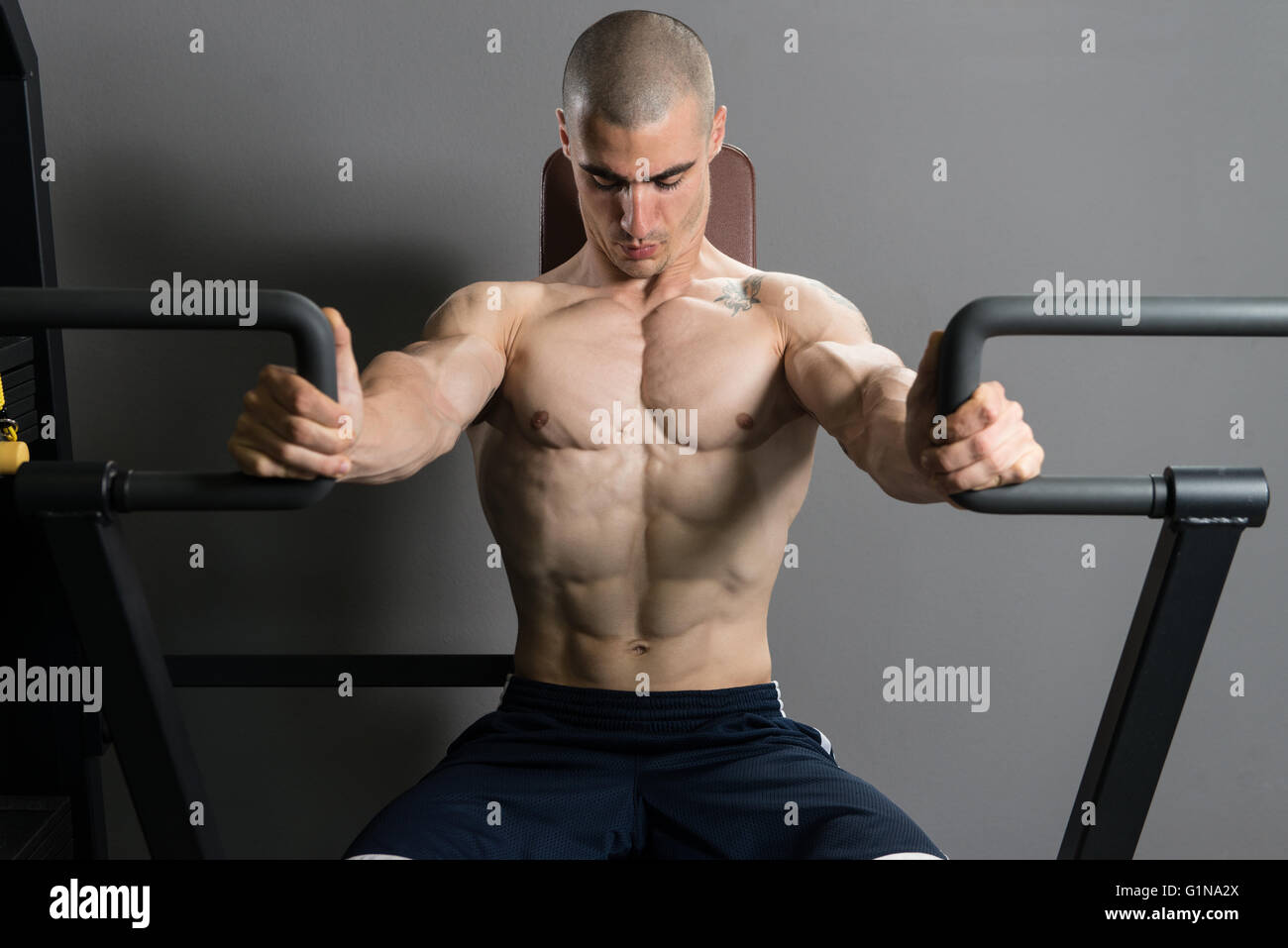 Young Bodybuilder Doing Heavy Weight Exercise For Chest Stock Photo - Alamy
