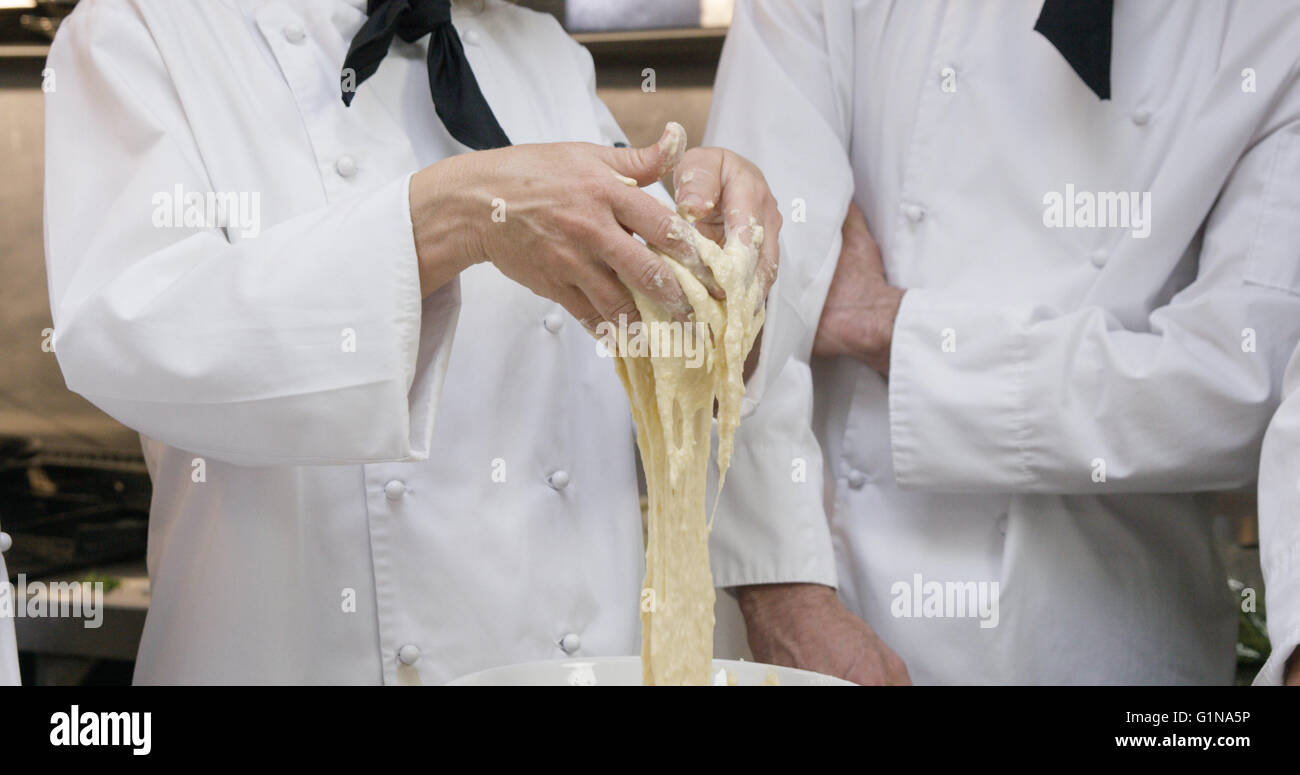 Cooker gourmets baking a pastry Stock Photo - Alamy